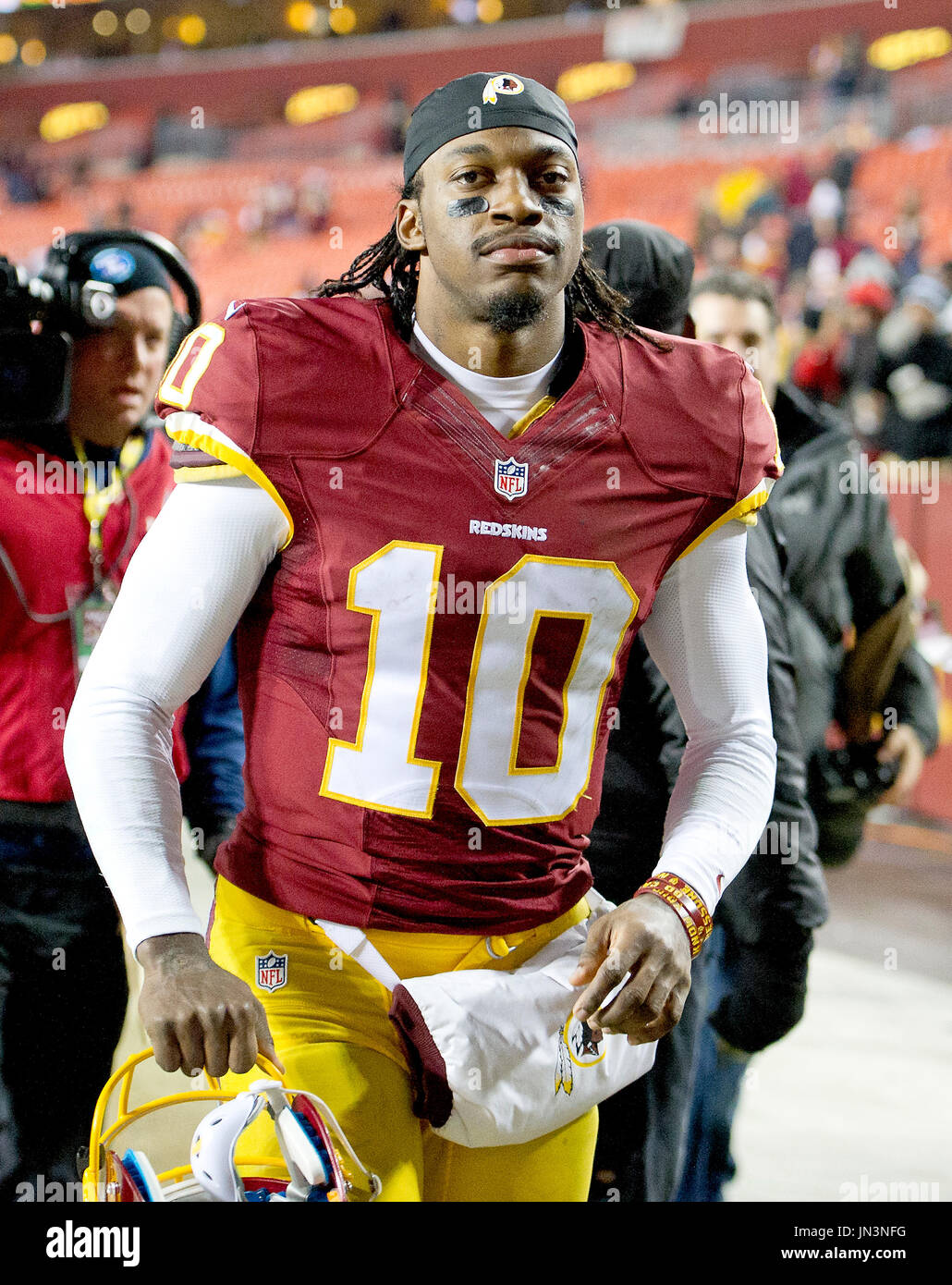 Washington Redskins quarterback Robert Griffin III (10) leaves the ...