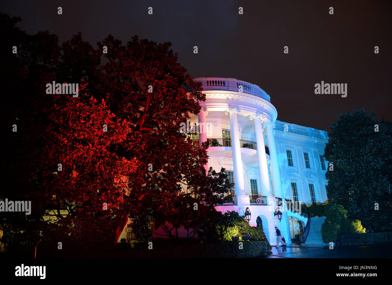 The White House is colored in red, white and blue to celebrate "A ...