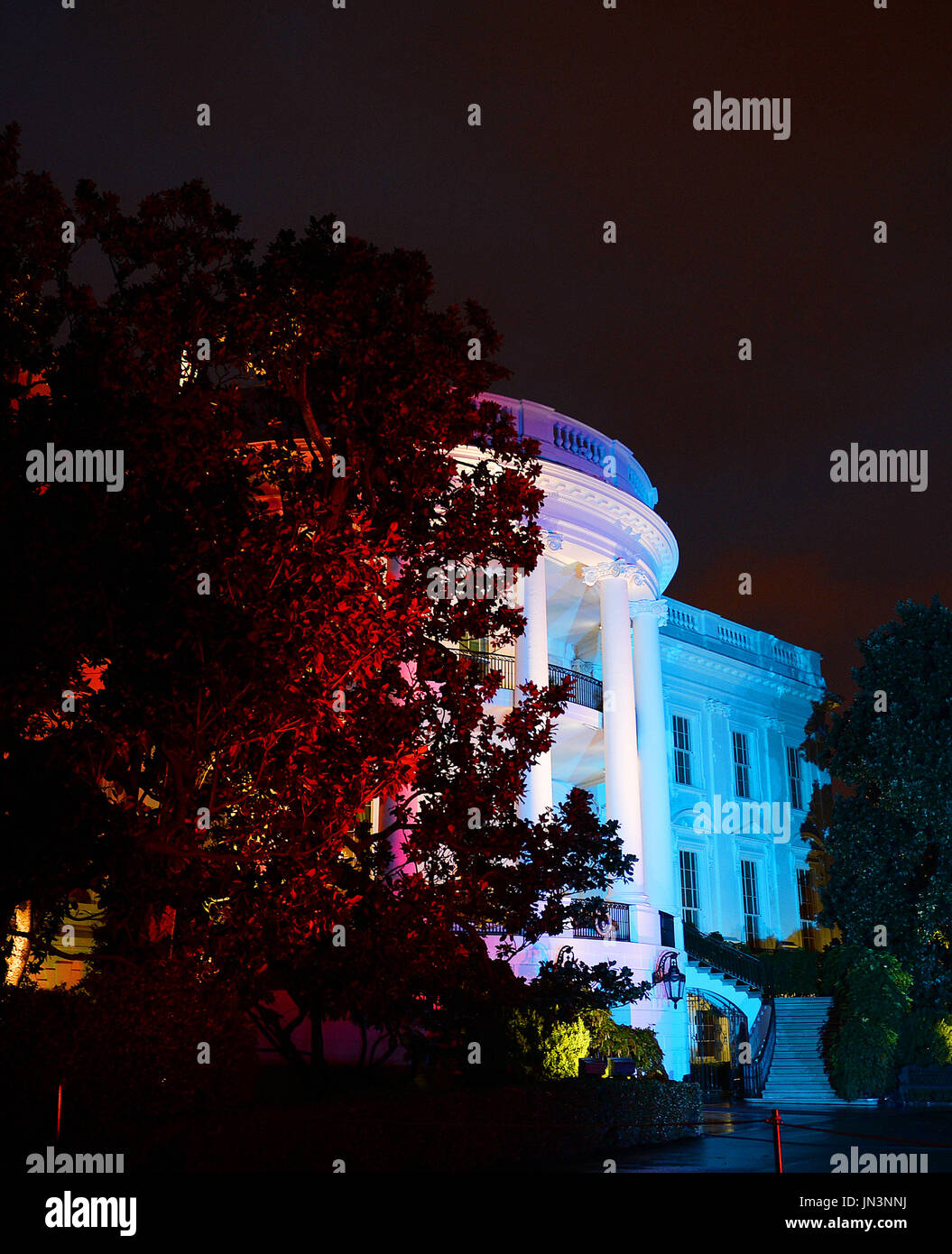 The White House is colored in red, white and blue to celebrate "A ...