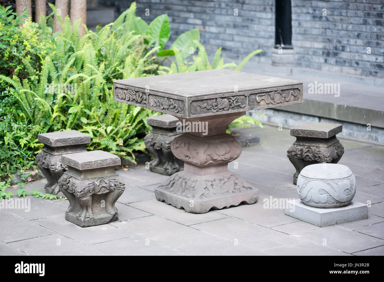 Stone table and sits in a chinese taoist temple Stock Photo - Alamy