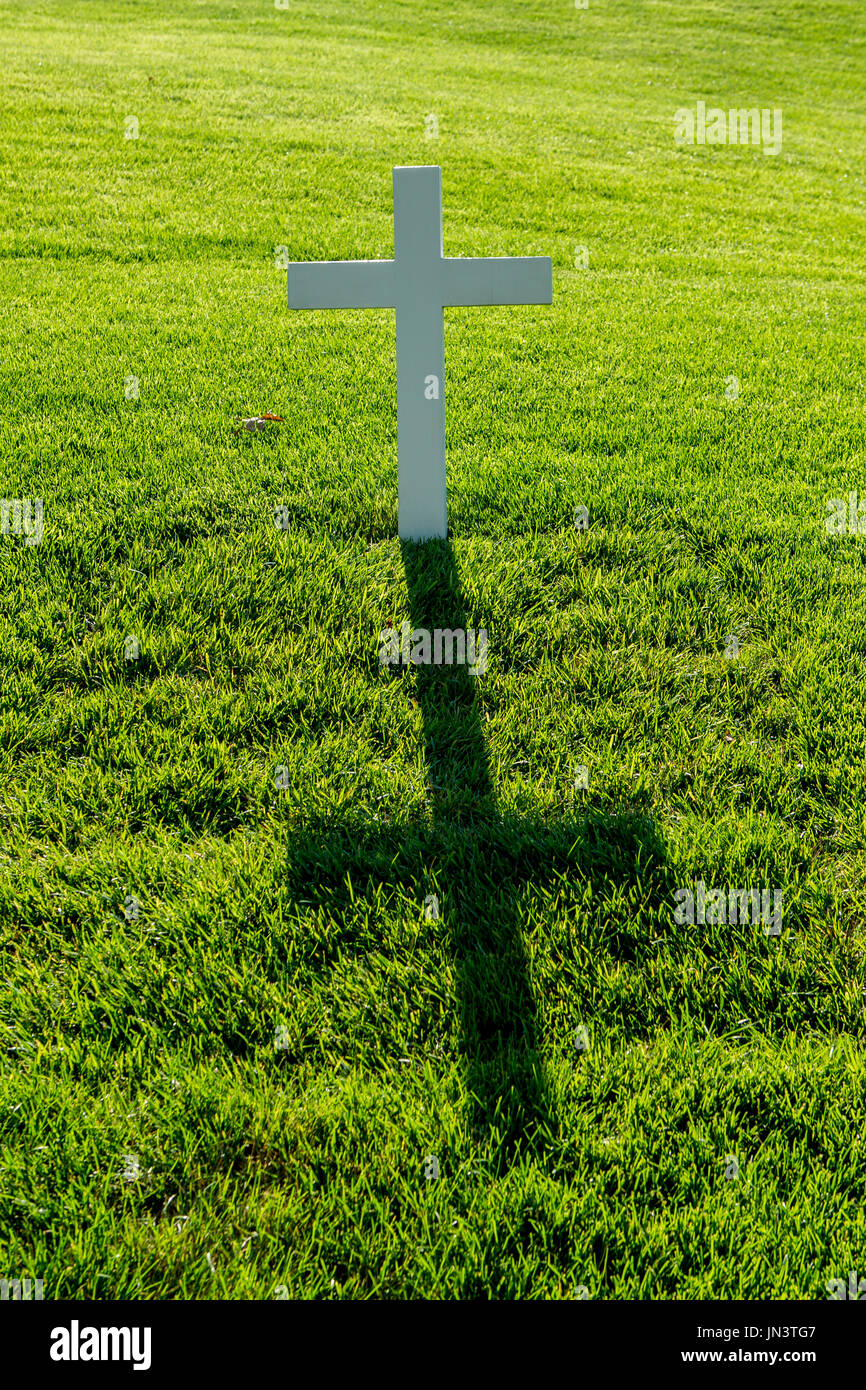 A cross and its shadow in a green lawn Stock Photo - Alamy