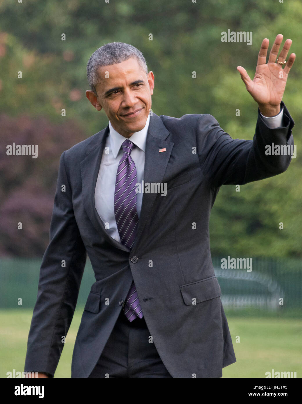 United States President Barack Obama waves to guests as he arrives on ...