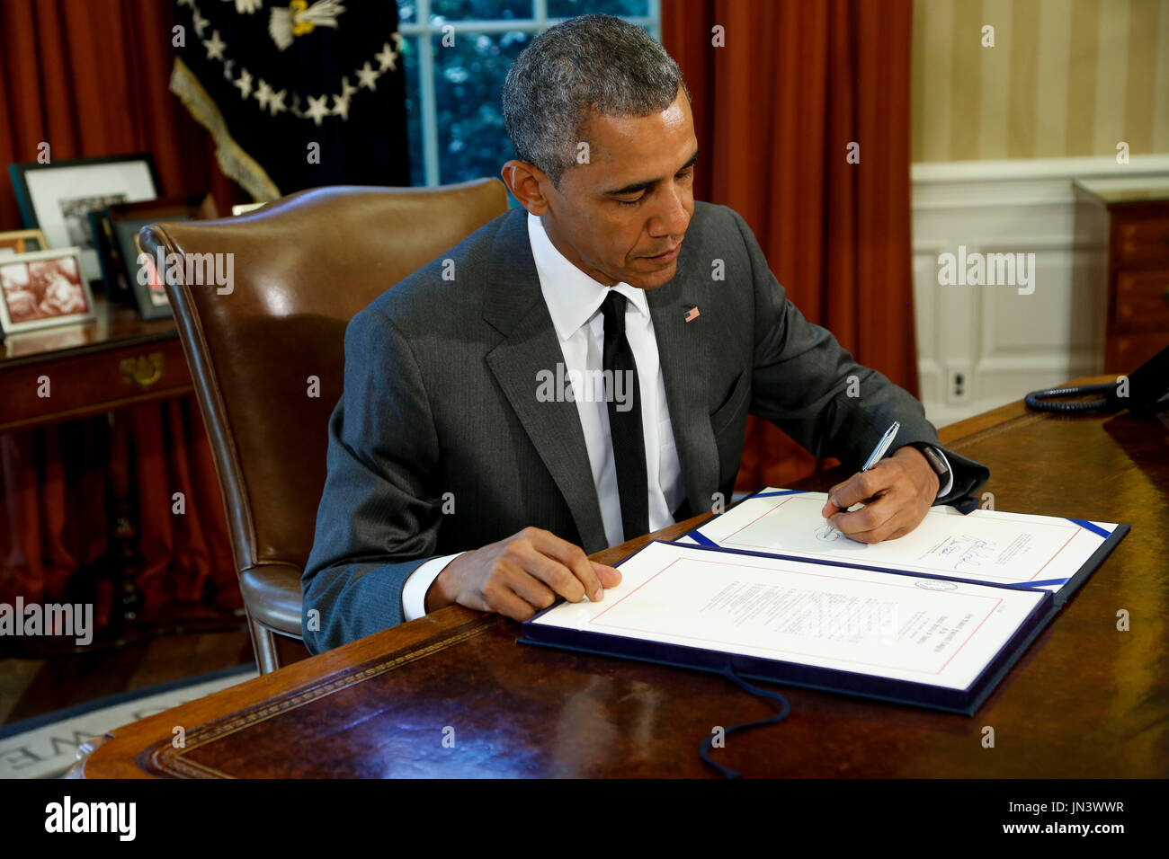 United States President Barack Obama signs the three month extension of ...