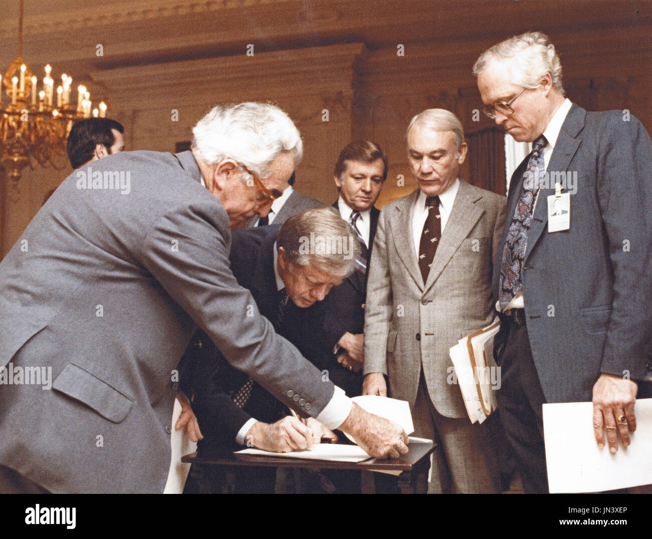 United States President Jimmy Carter signs the document freezing ...