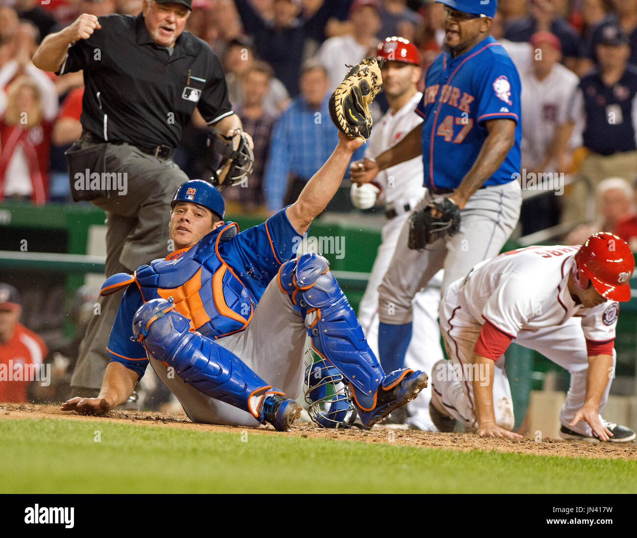 New York Mets catcher Anthony Recker (20) shows the ball after tagging ...