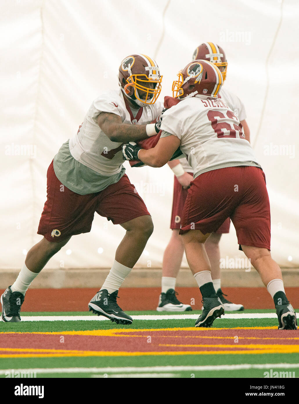 Offensive linemen Morgan Moses (76) of Virginia, left, and Trevita ...