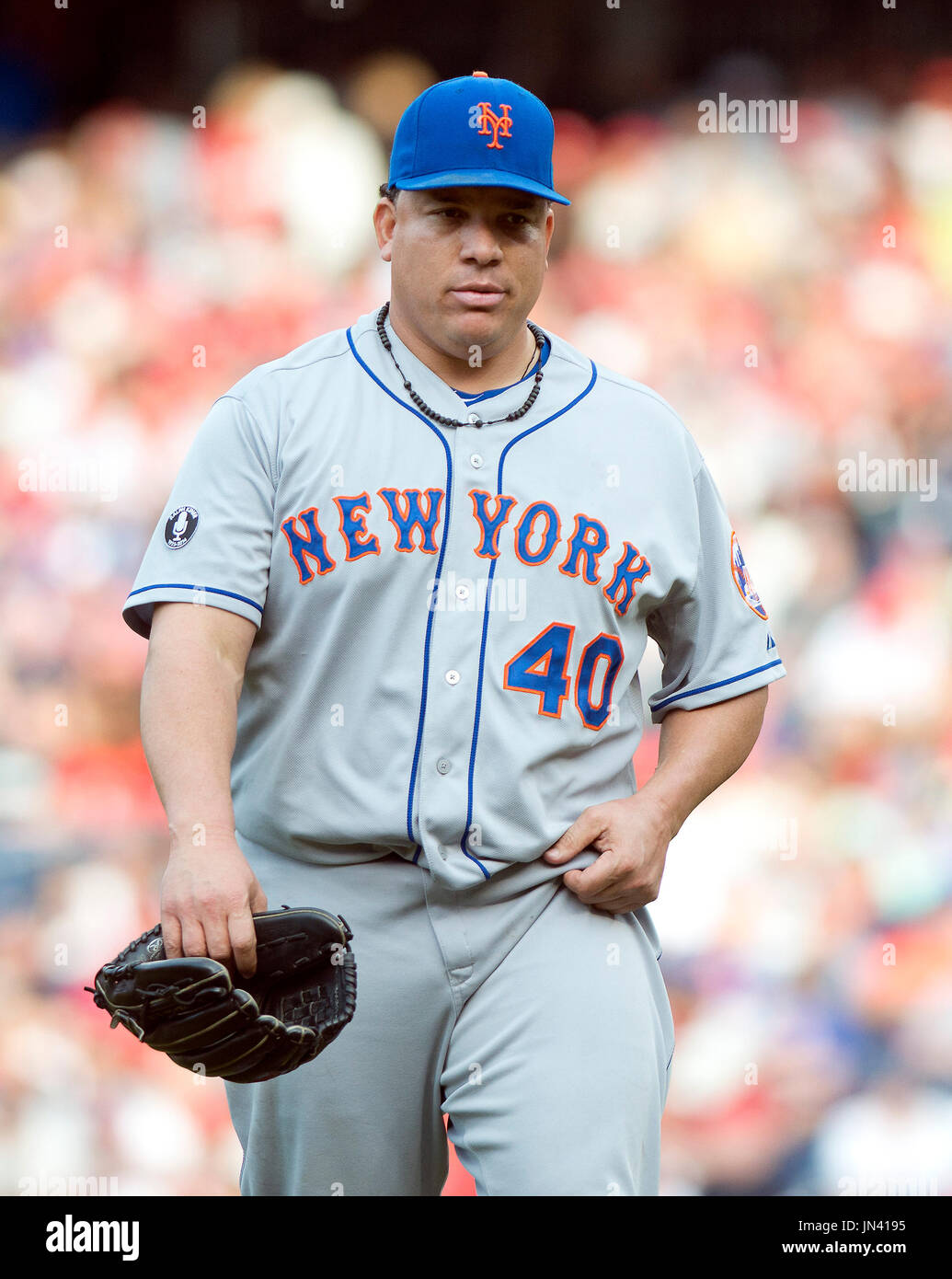 New York Mets pitcher Bartolo Colon (40) leave the field after retiring ...