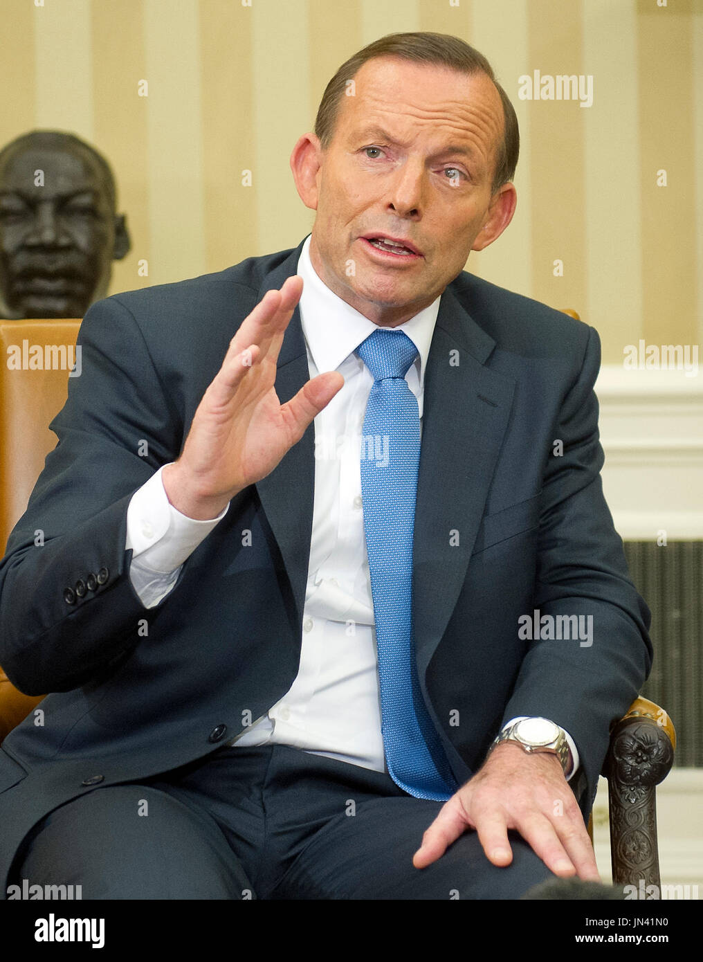 Prime Minister Tony Abbott of Australia meets reporters following a ...