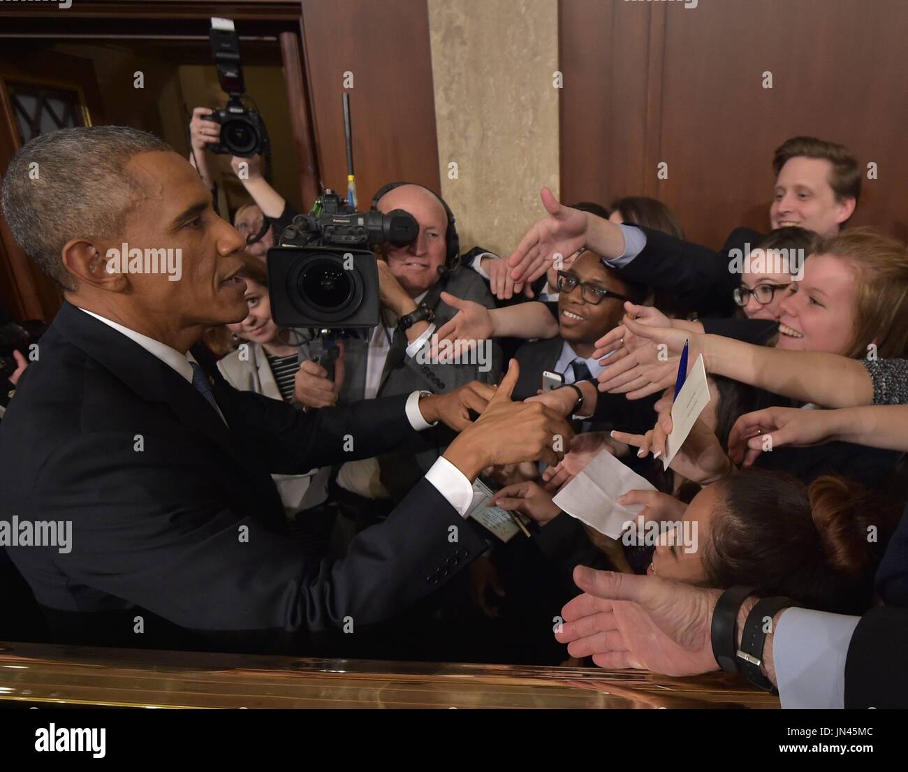 US President Barack Obama shakes hands after delivering the State of ...