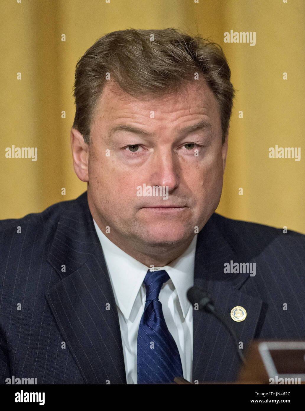 United States Senator Dean Heller (Republican of Nevada) listens as ...