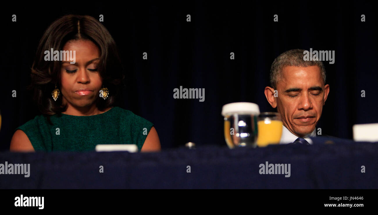 United States President Barack Obama and first lady Michelle Obama bow ...