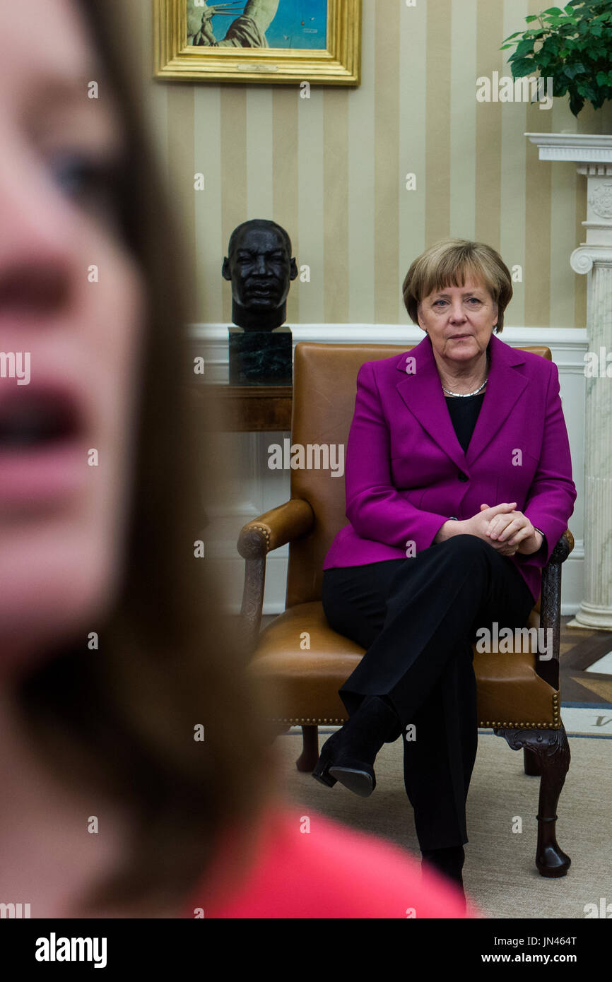 German Chancellor Angela Merkel poses for a photo op with US President ...