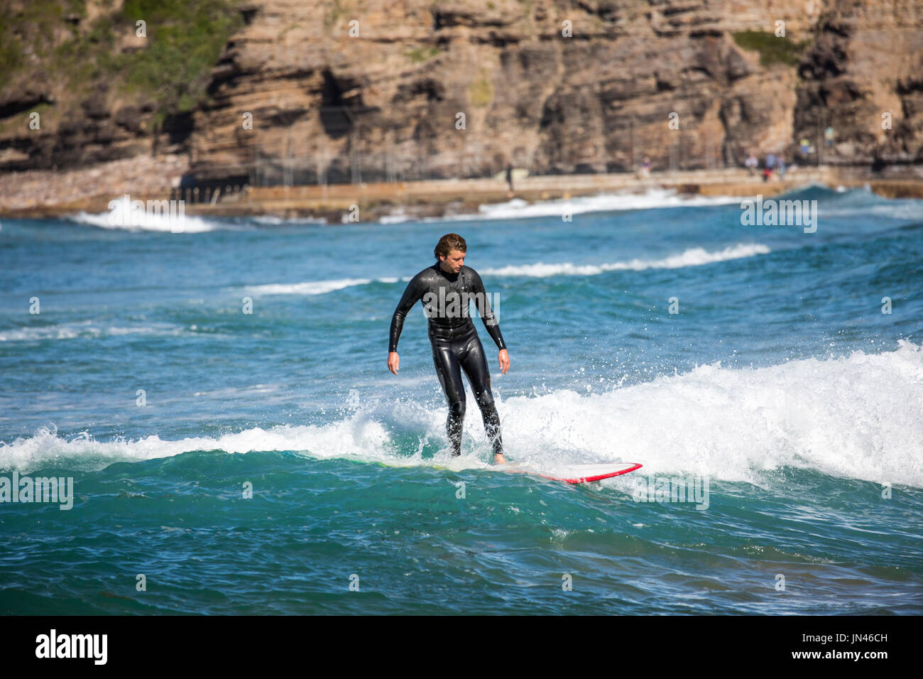 Australian man surfing the waves at Avalon beach in Sydney,New south ...