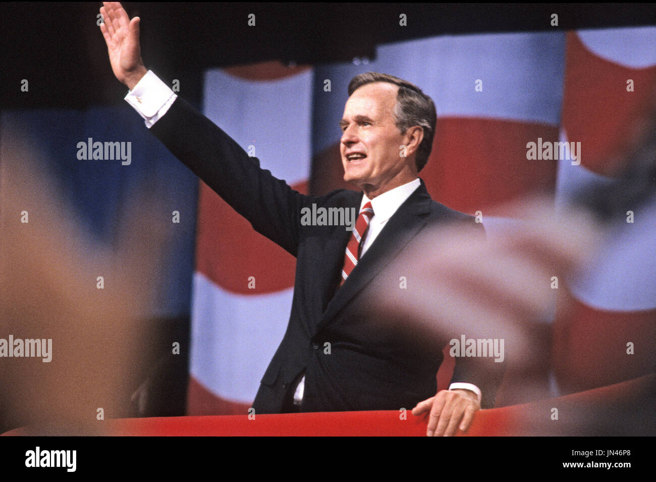 United States Vice President George H.W. Bush waves to the crowd from ...