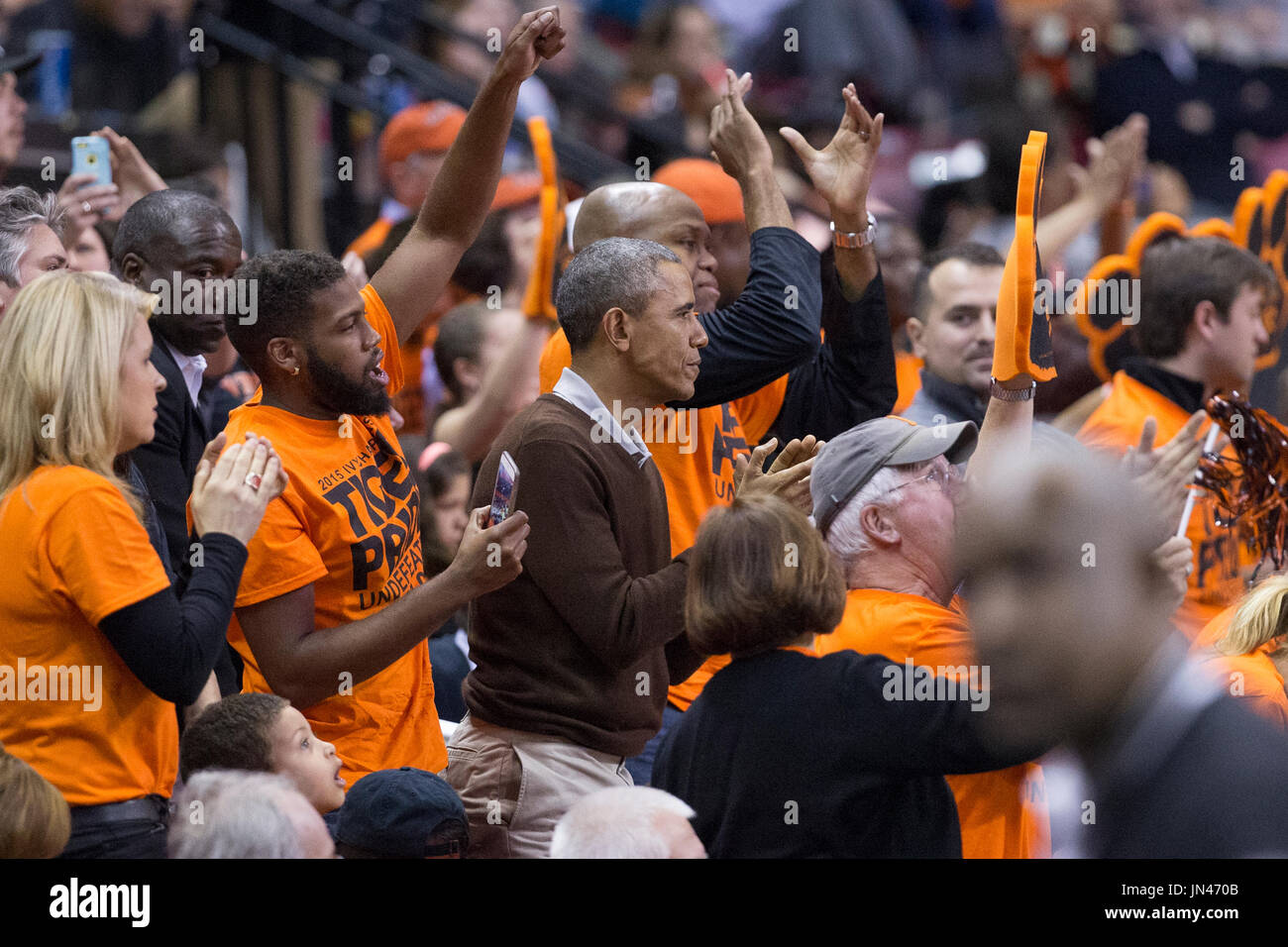 US President Barack Obama (C) stands beside his brother-in-law Craig ...