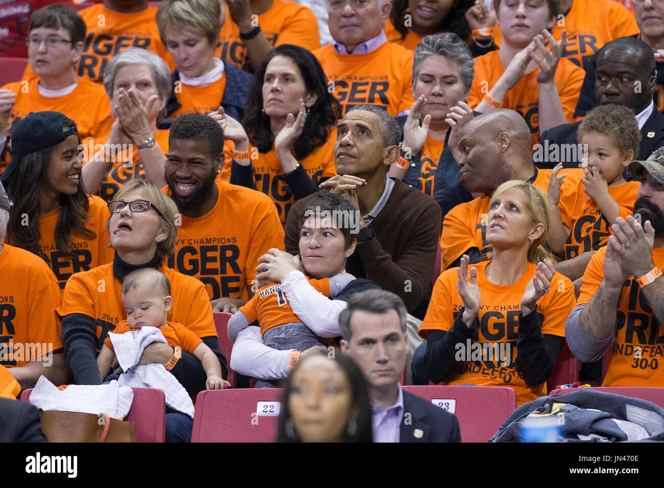 US President Barack Obama (C) sits with his brother-in-law Craig ...