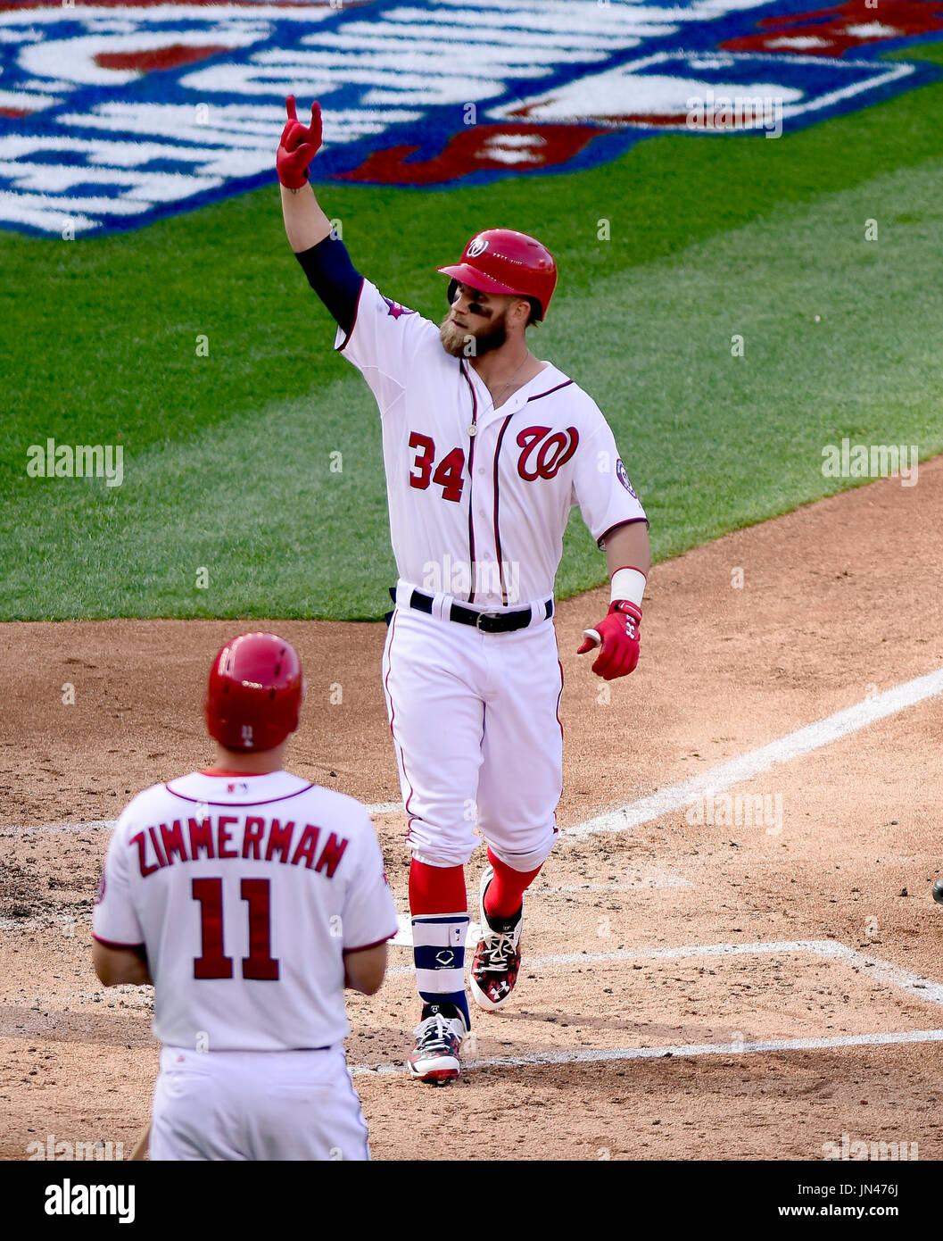 Washington Nationals right fielder Bryce Harper (34) acknowledges the ...
