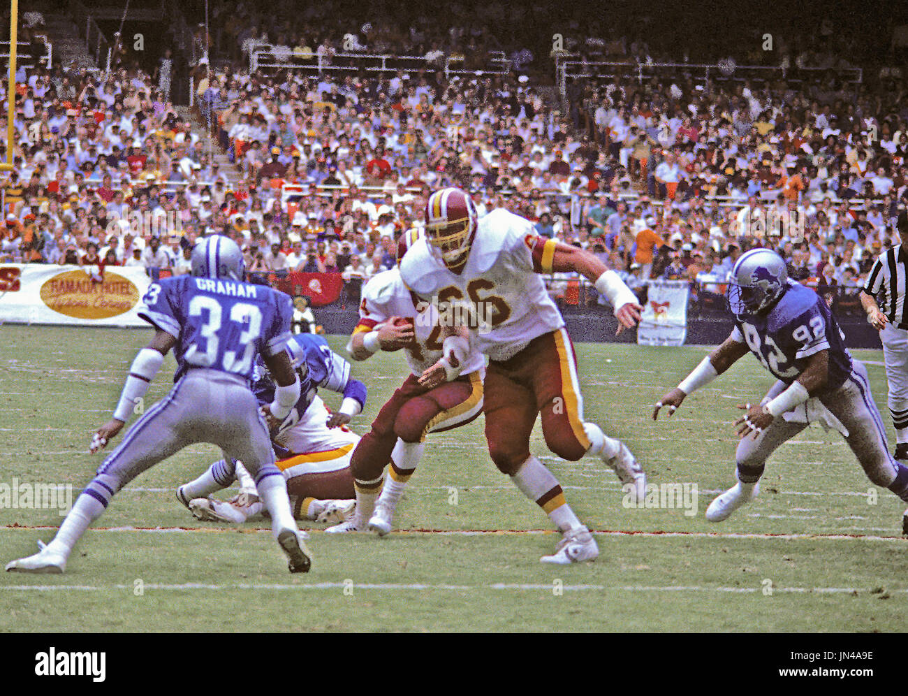 Washington Redskins left tackle Joe Jacoby (66) leads running back John ...