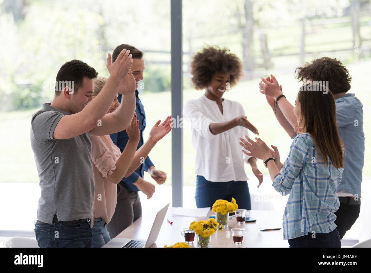 multiethnic Group of young business people looking happy while ...