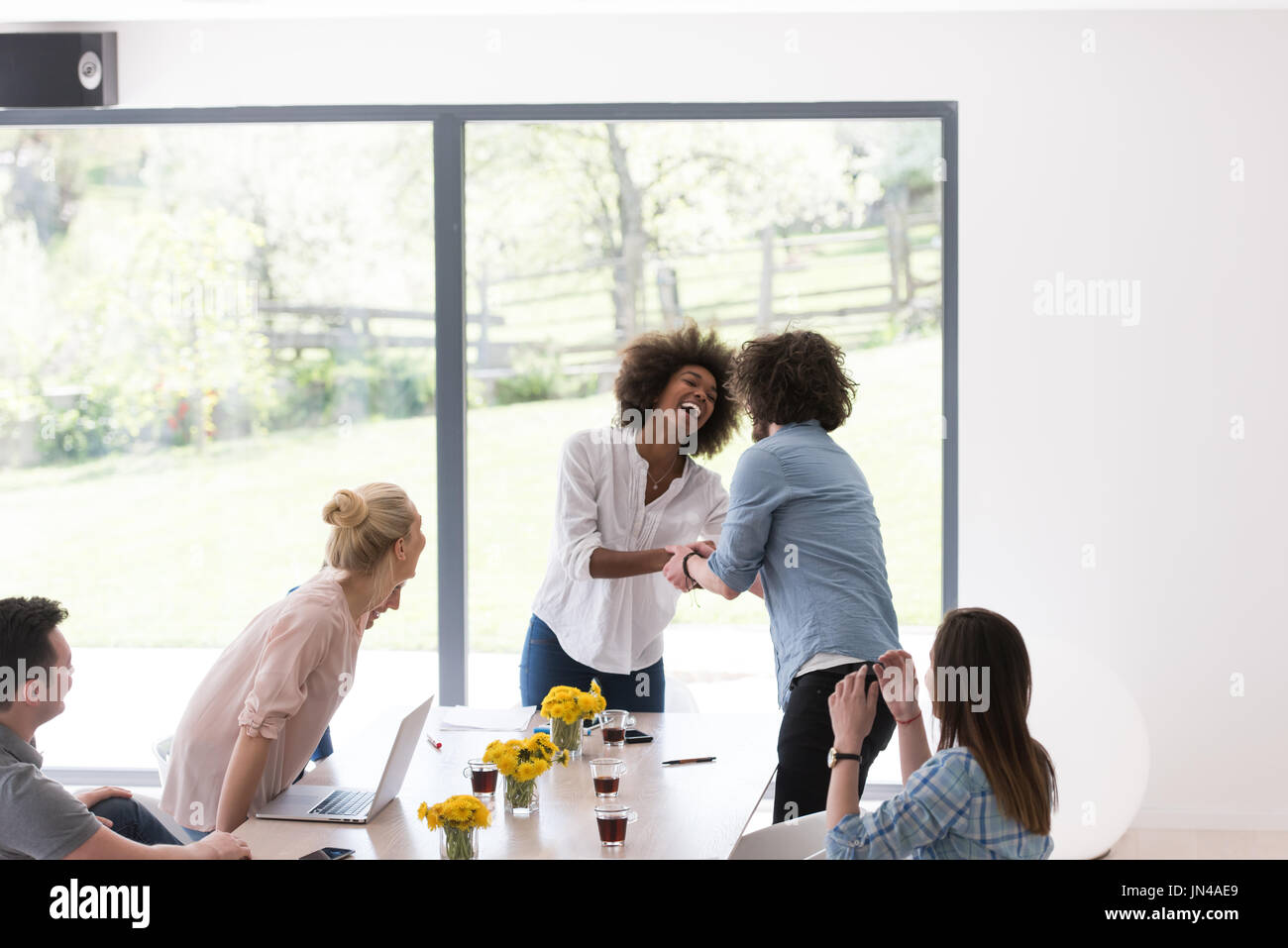 multiethnic Group of young business people looking happy while ...