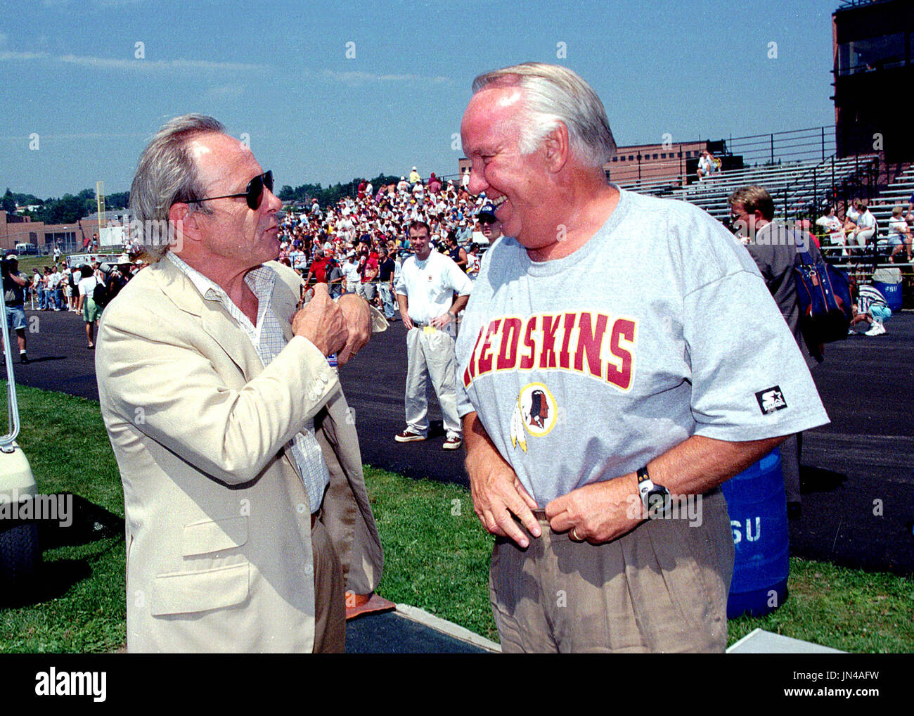 Washington Redskins team owner John Kent Cooke Sr., chats with former ...