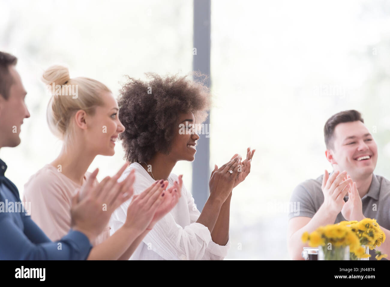 multiethnic Group of young business people looking happy while ...