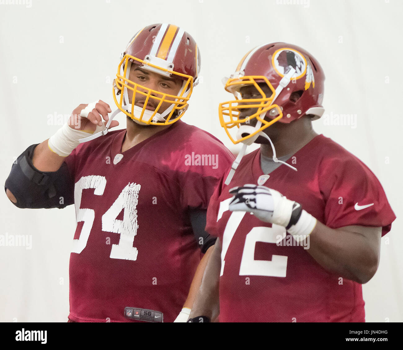 Washington Redskins defensive end Kedric Golston (64) and nose tackle ...