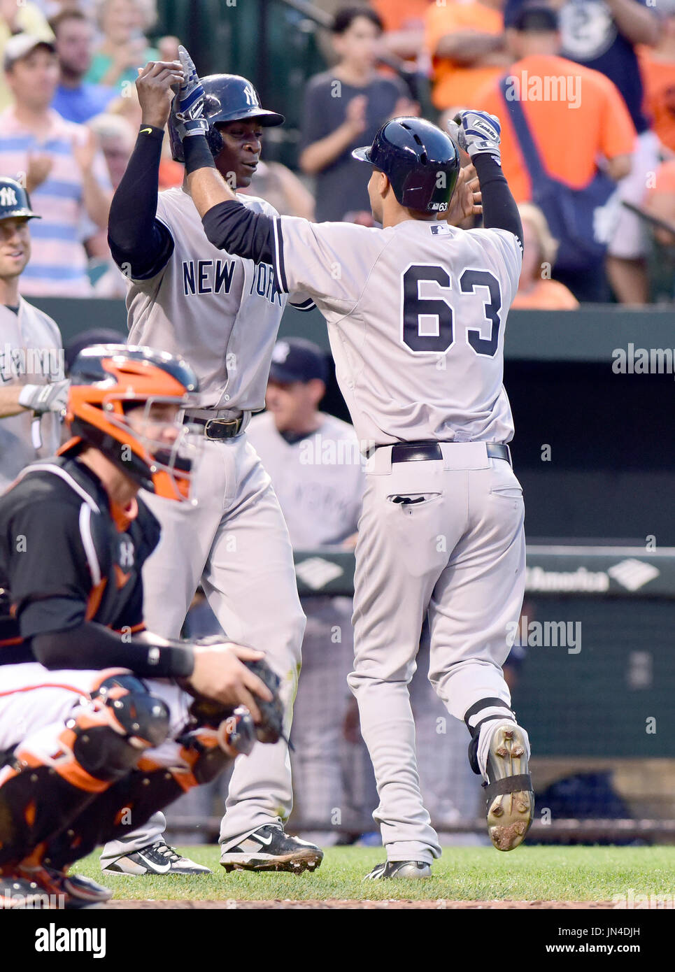 New York Yankees center fielder Mason Williams (65) is congratulated by ...
