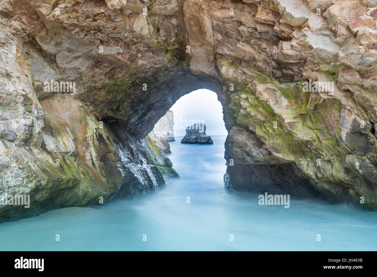 Sea Cave in Shark Tooth Beach Stock Photo - Alamy