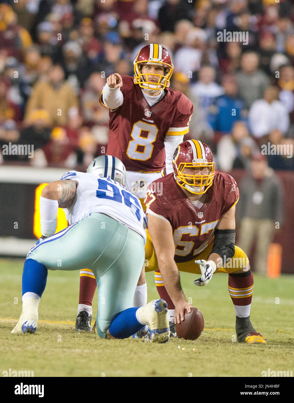 Washington Redskins quarterback Kirk Cousins (8) directs the offense as ...