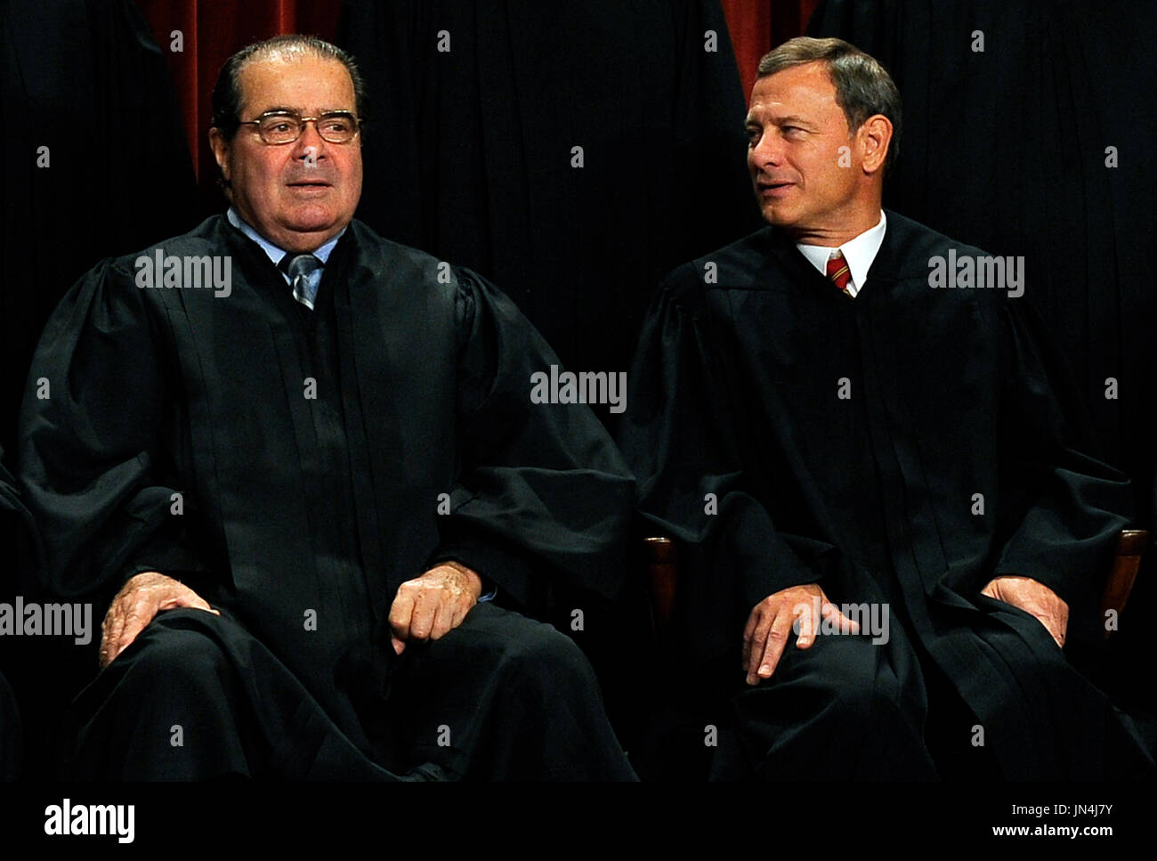 Chief Justice John G. Roberts (R) chats with Associate Justice Antonin ...