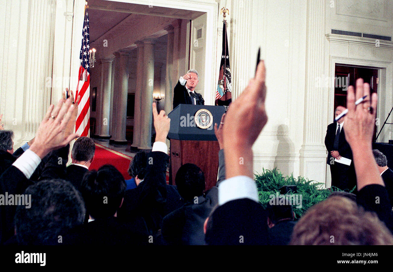 United States President Bill Clinton calls on a reporter during his ...