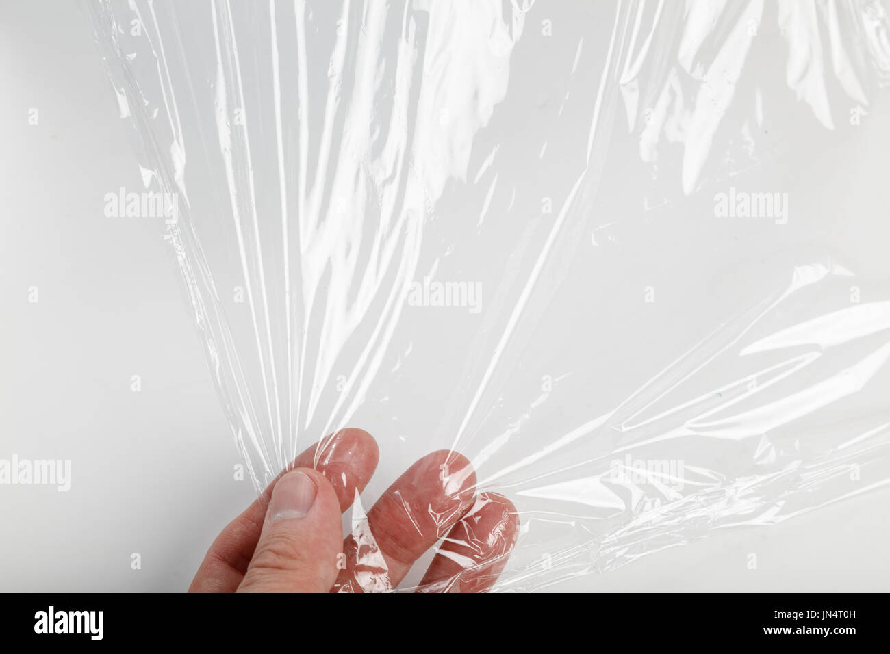 wrapping plastic transparent food film on white background Stock Photo ...