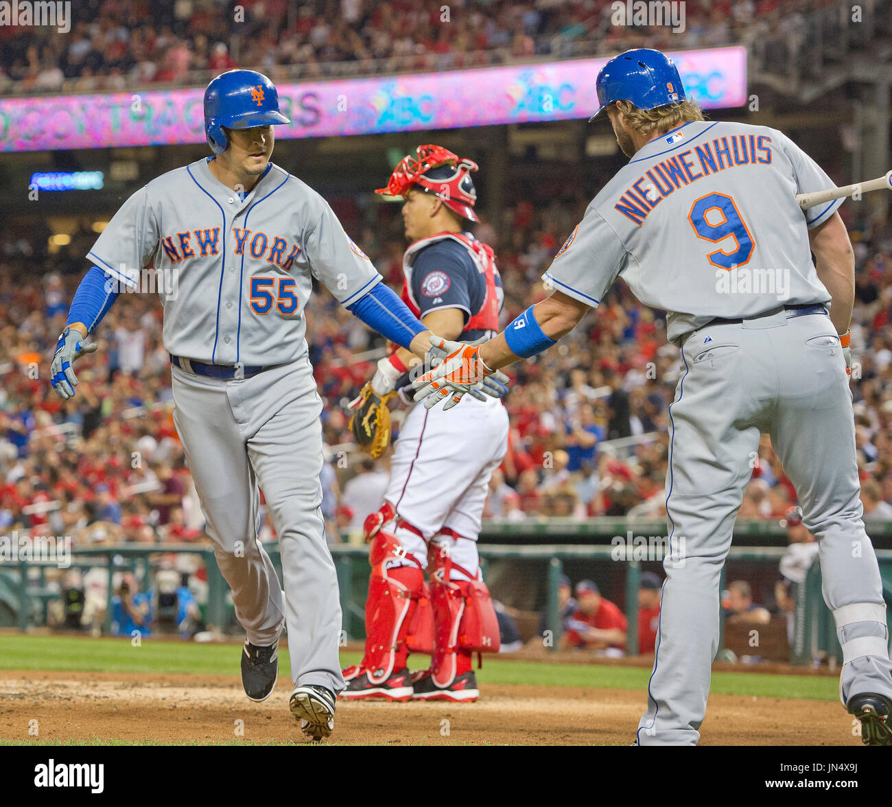 New York Mets second baseman Kelly Johnson (55) is congratulated by ...