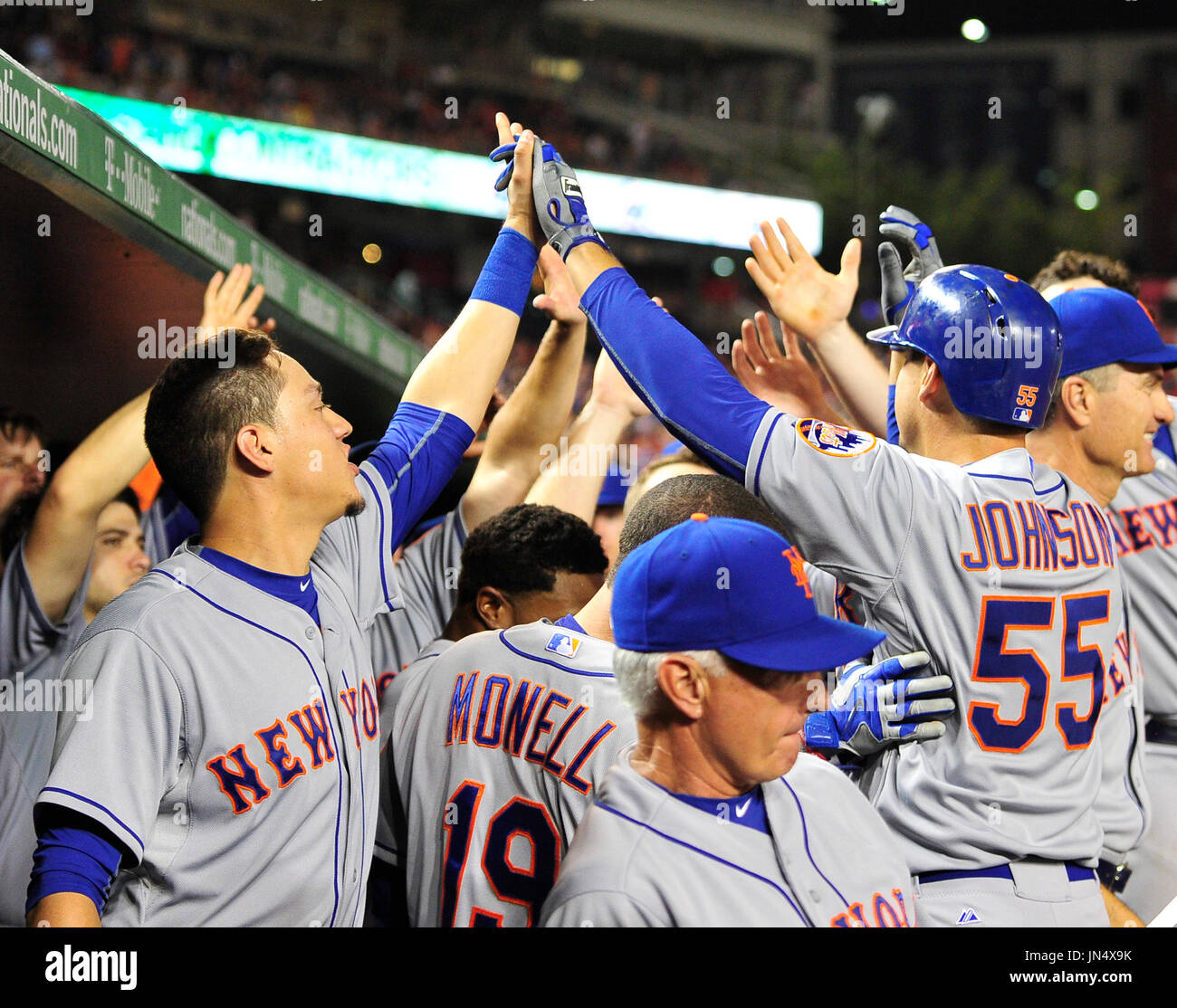 New York Mets second baseman Kelly Johnson (55) is congratulated by his ...