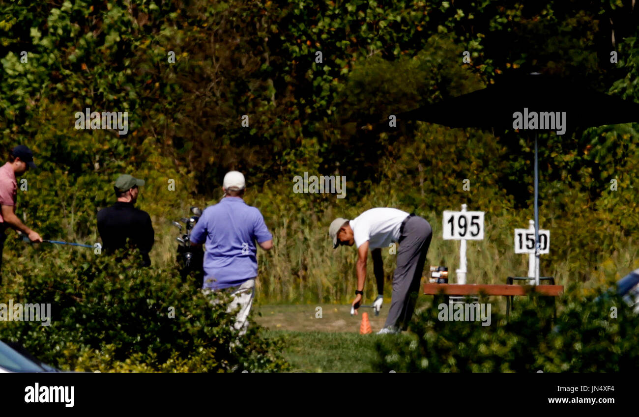 United States President Barack Obama does some stretching exercises ...