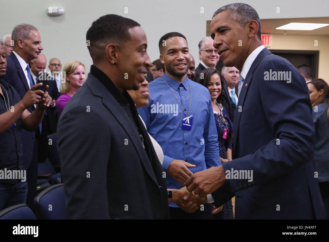 United States President Barack Obama (R) greets hip-hop artist Ludacris ...