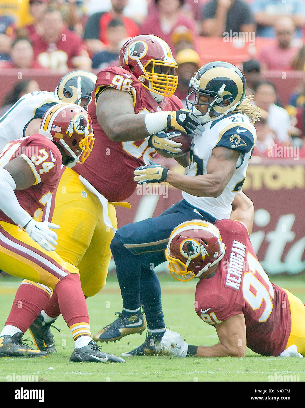 St. Louis Rams running back Tre Mason (27) is tackled by Washington ...
