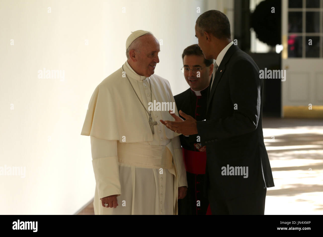 U.S. President Barack Obama (R) escorts Pope Francis (L) down the West ...