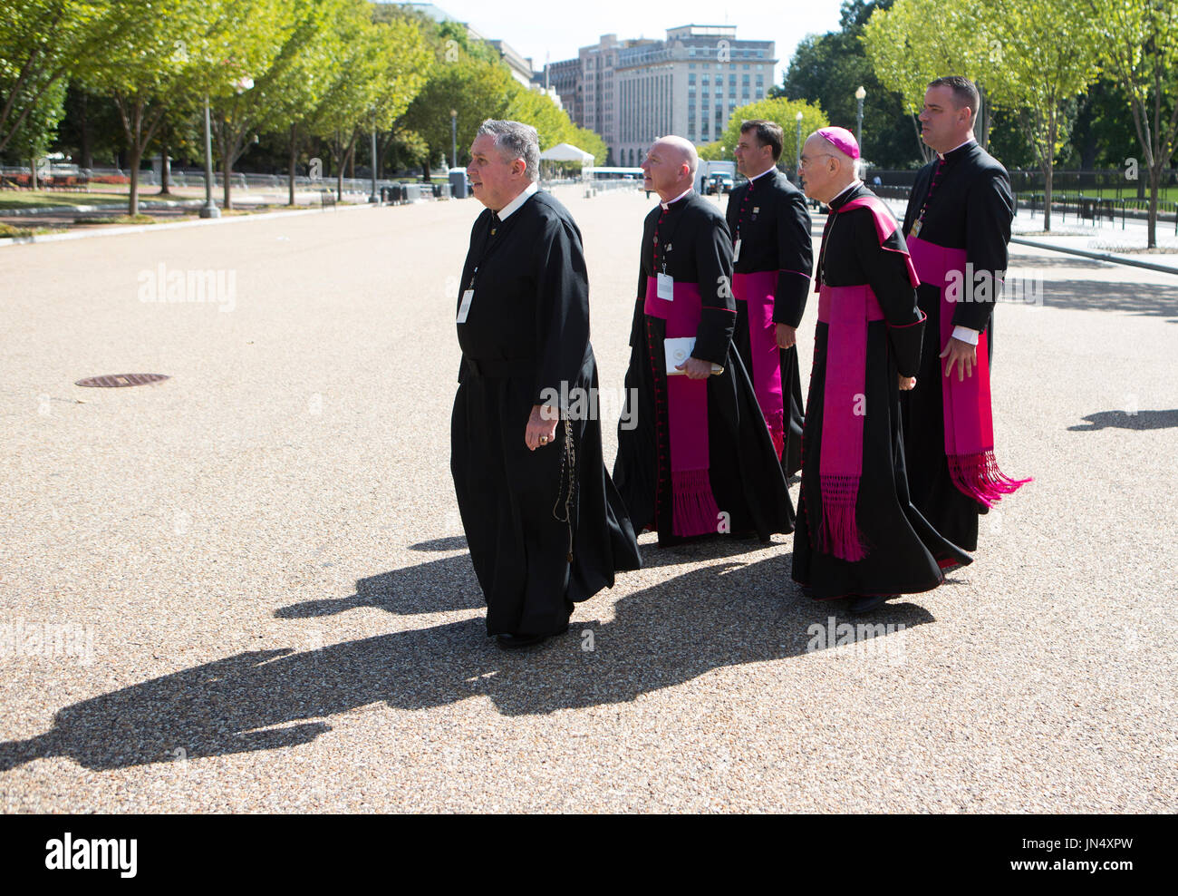 A group of priests depart from an Official State Welcome ceremony for ...