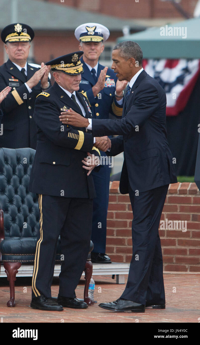 US President Barack Obama congratulates General Martin Dempsey during ...