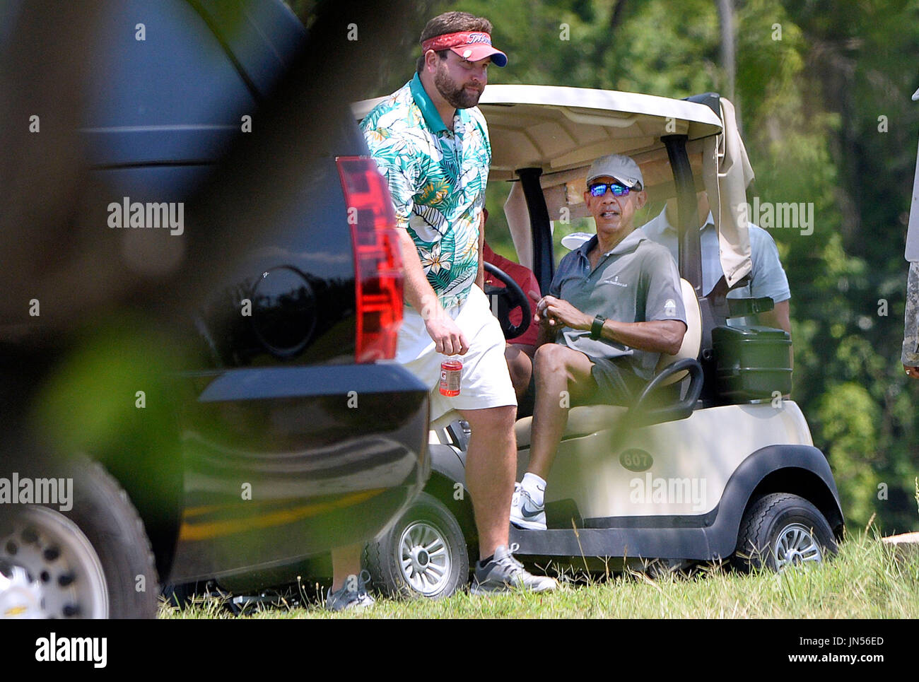 United States President Barack Obama parks his golf cart after playing ...