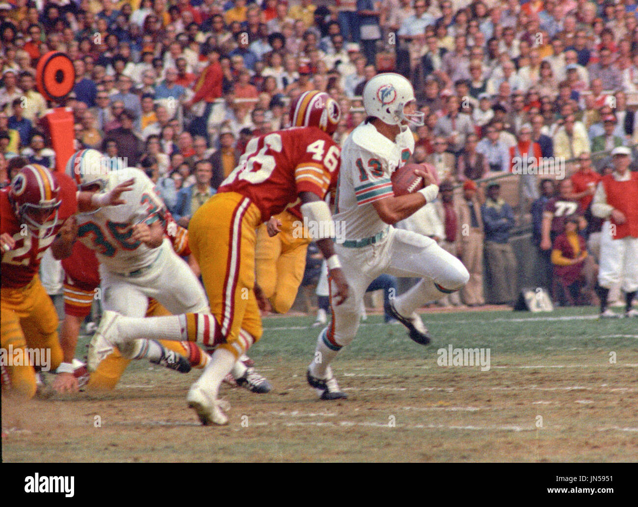 Miami Dolphins free safety Jake Scott (13) returns a punt during the ...