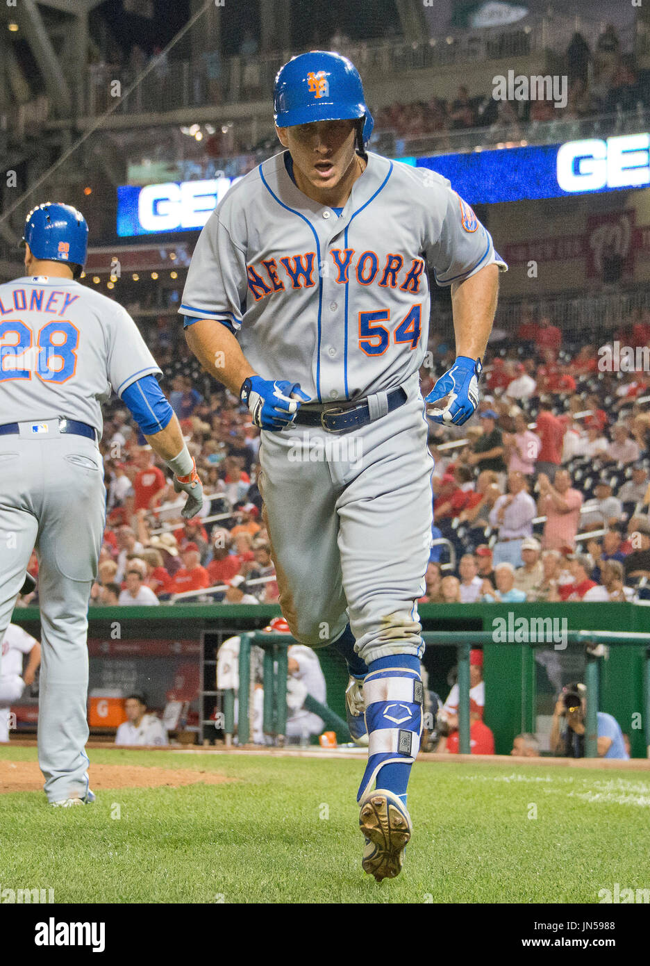 New York Mets third baseman T.J. Rivera (54) runs to the dug-out to ...