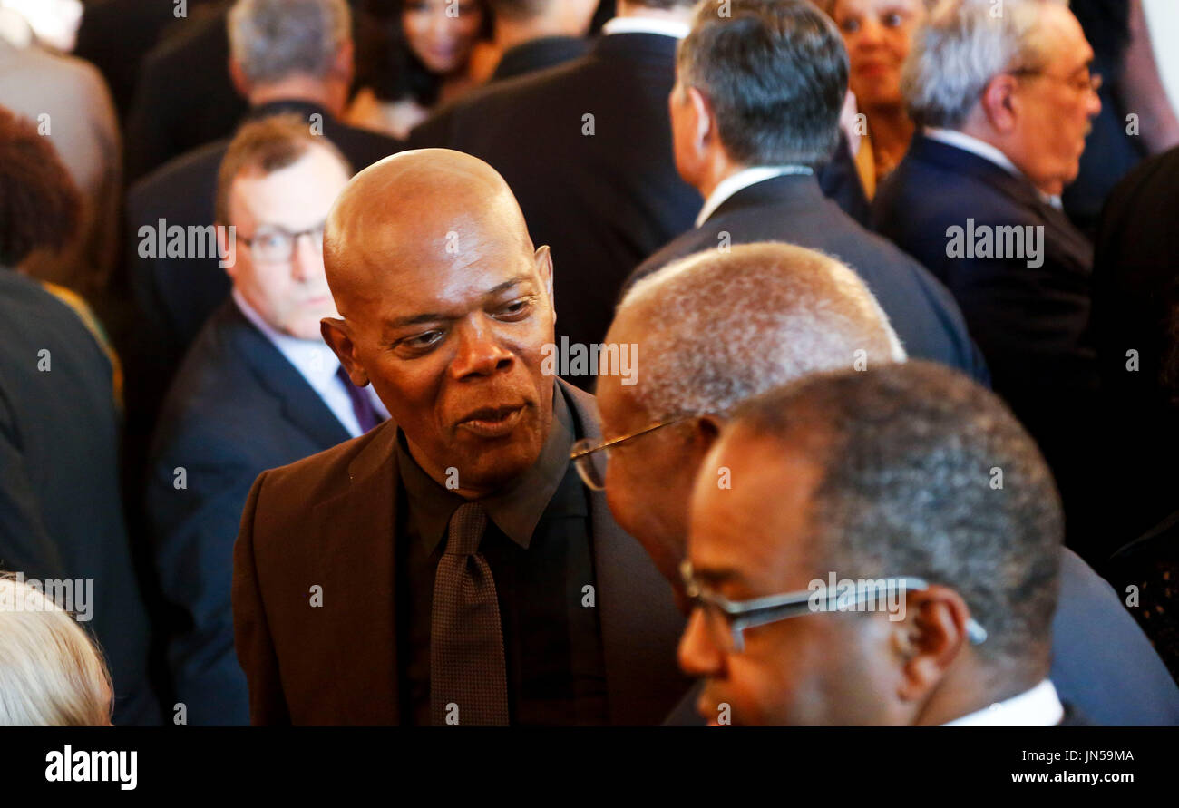 Actor Samuel Jackson speaks with guests during a reception in honor of ...