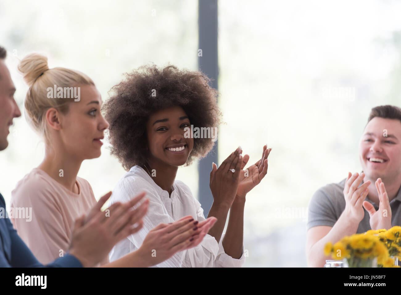 multiethnic Group of young business people looking happy while ...