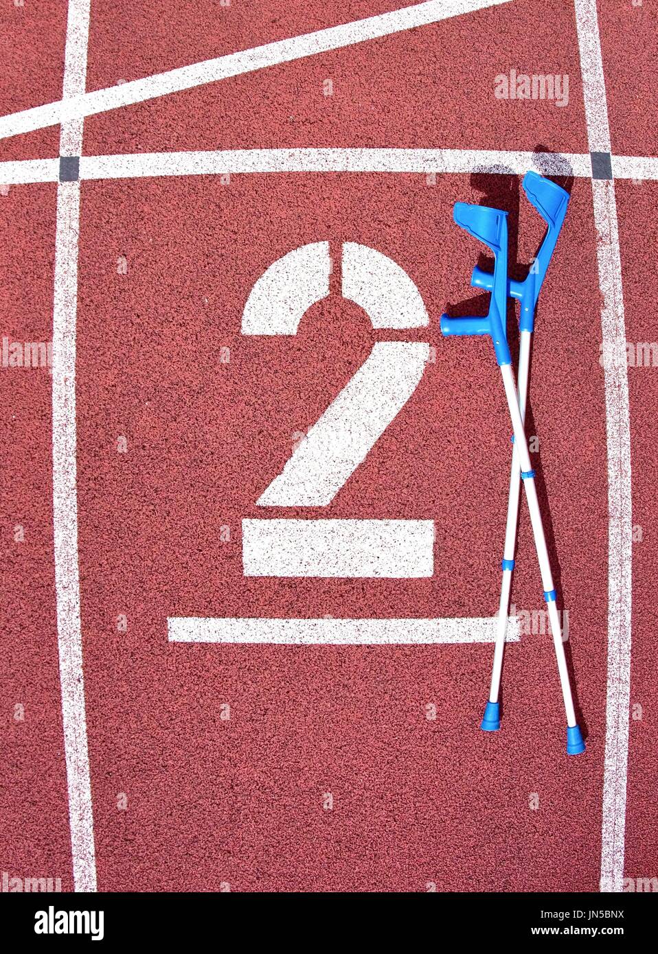 Medicine crutch. Number two. Big white track number on red rubber ...