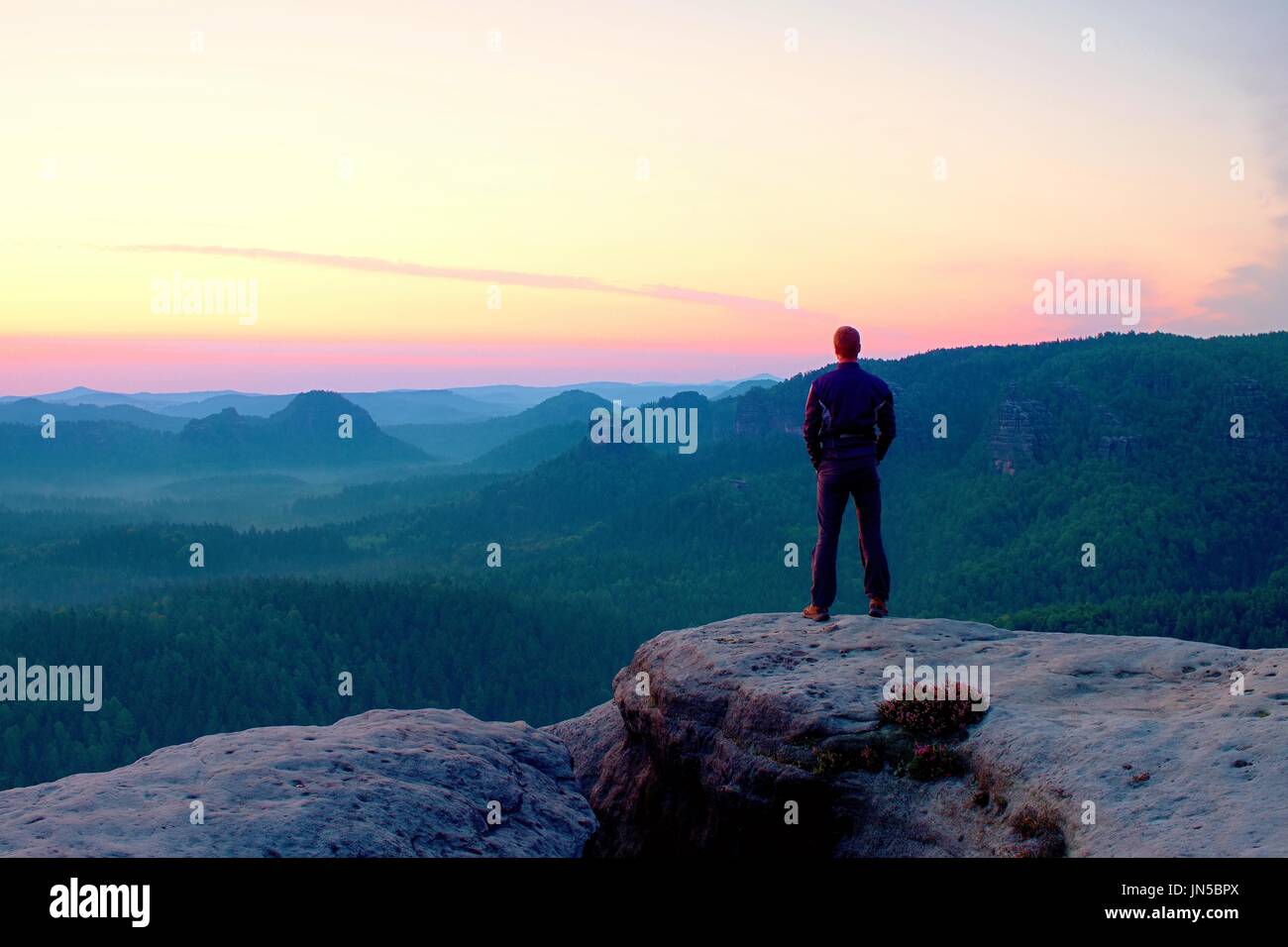 Hiker stand on the sharp corner of sandstone rock in rock empires park ...
