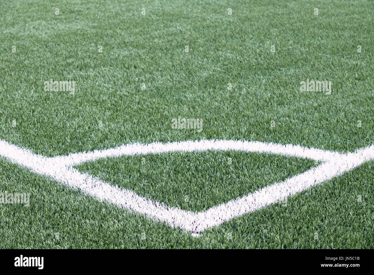 White corner line on green football field Stock Photo - Alamy