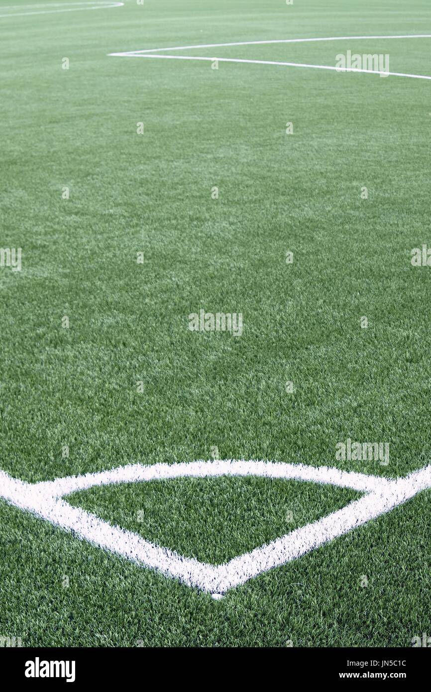 White corner line on green football field Stock Photo - Alamy